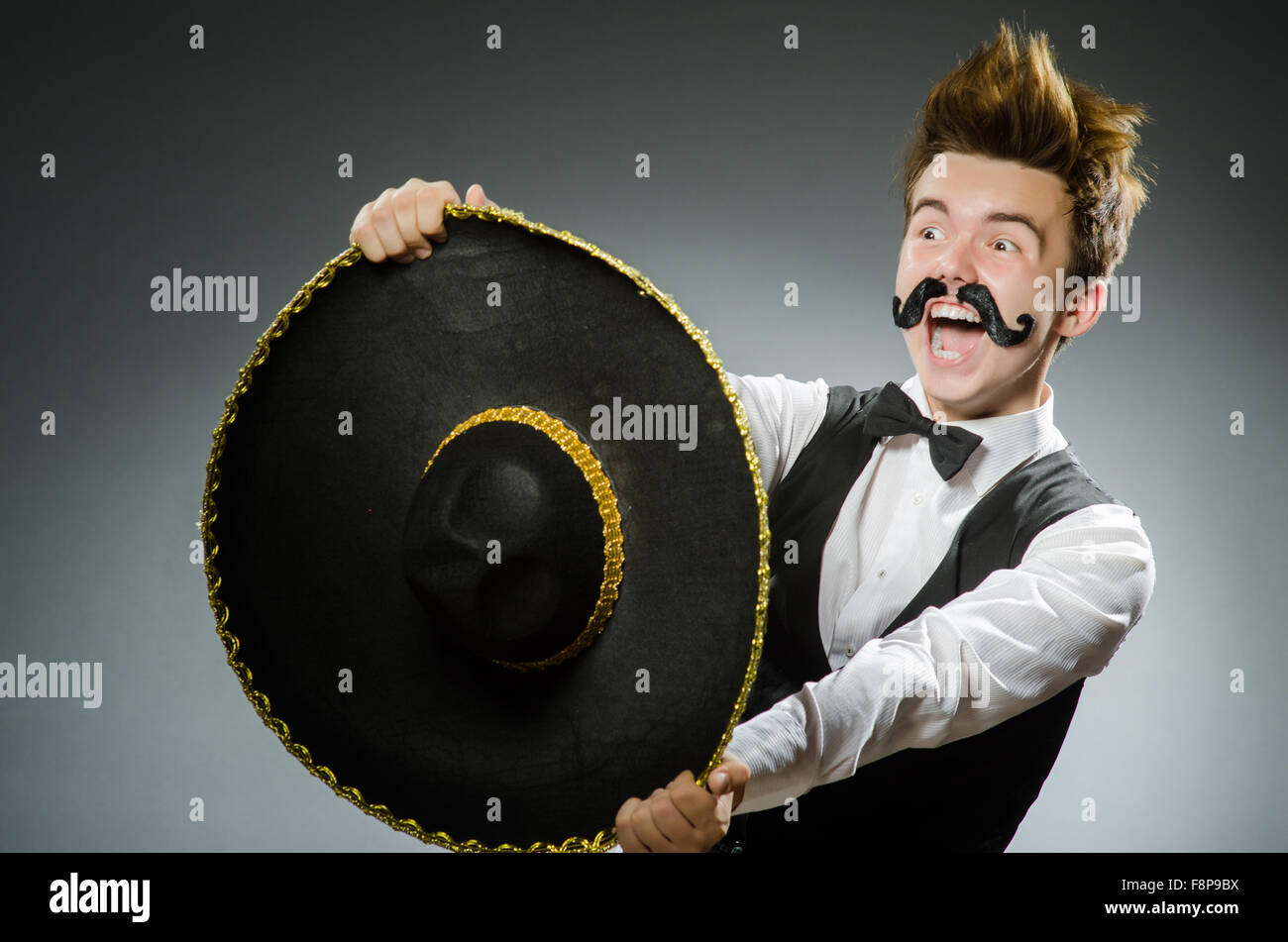 Smiling mexican with sombrero isolated on white Stock Photo - Alamy