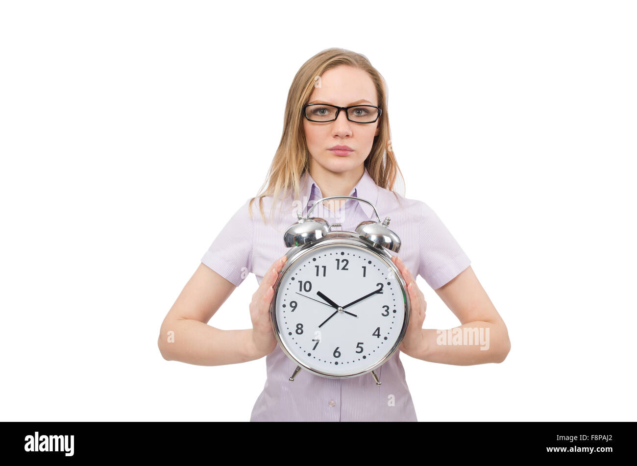 Young employee holding alarm clock isolated on white Stock Photo - Alamy