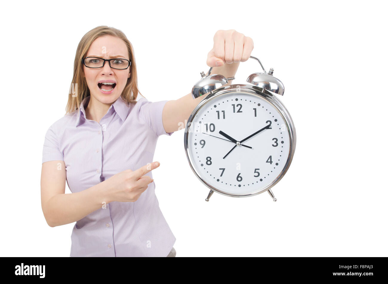 Young employee holding alarm clock isolated on white Stock Photo - Alamy