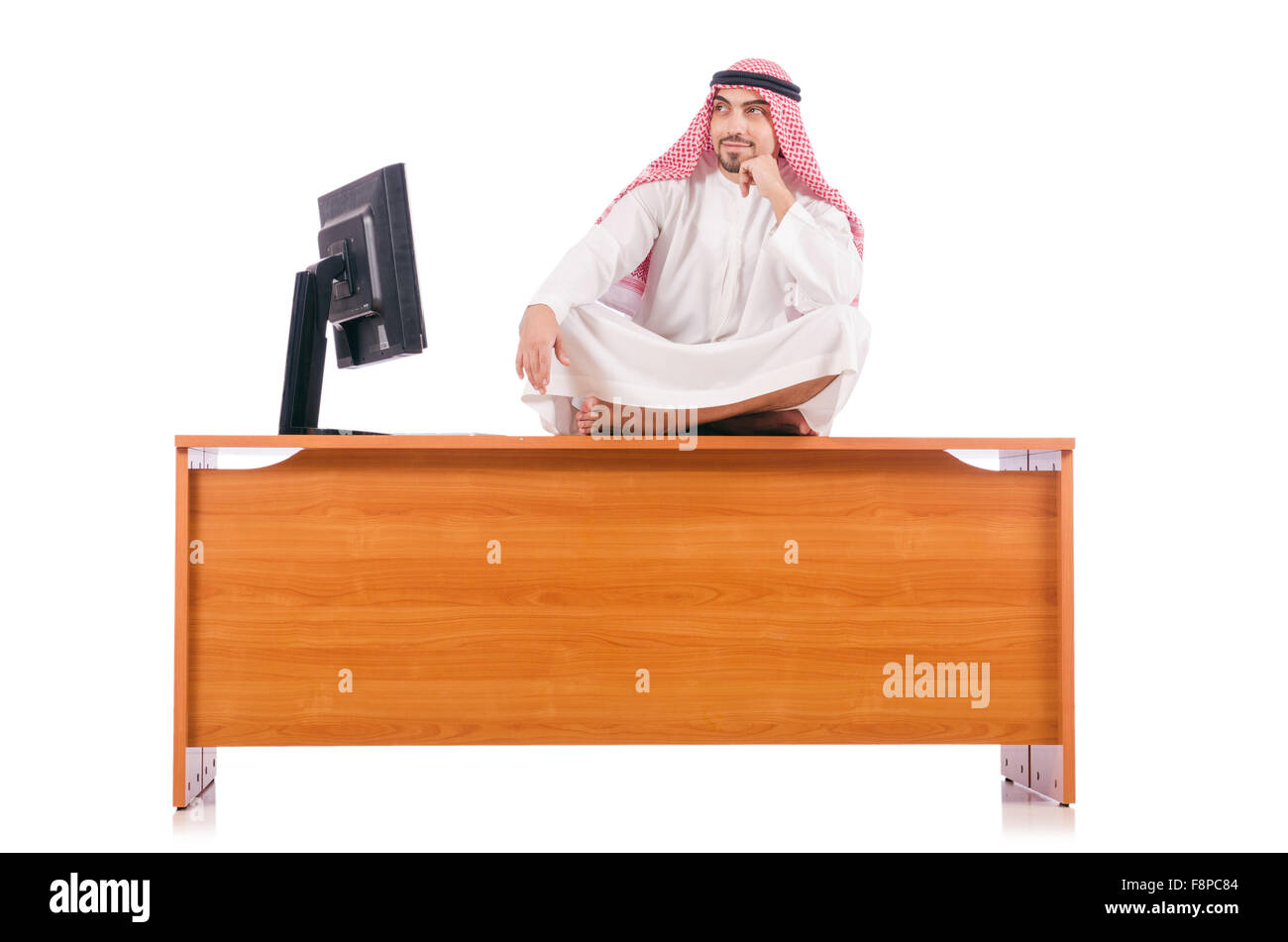 Arab man sitting at his desk Stock Photo - Alamy