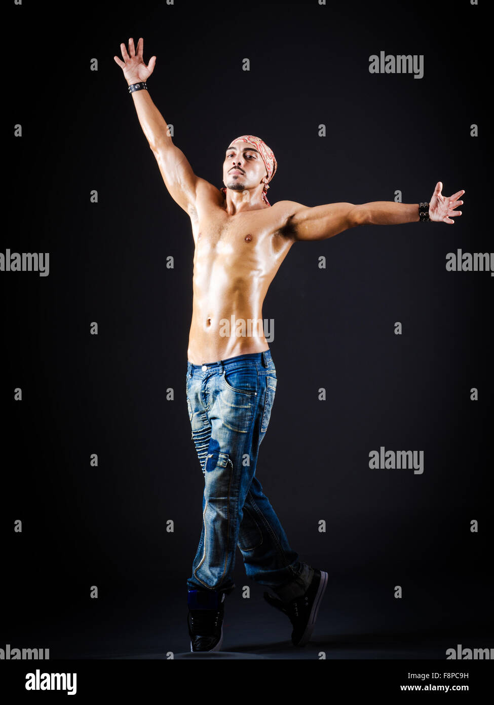 Dancer dancing in dark room Stock Photo - Alamy