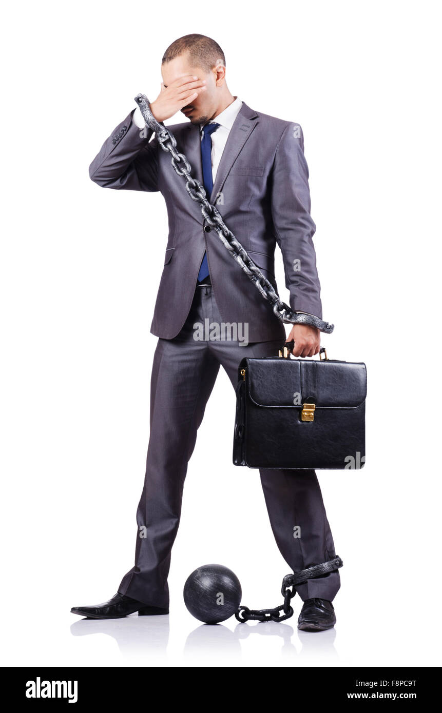 Businessman with shackles on white Stock Photo - Alamy