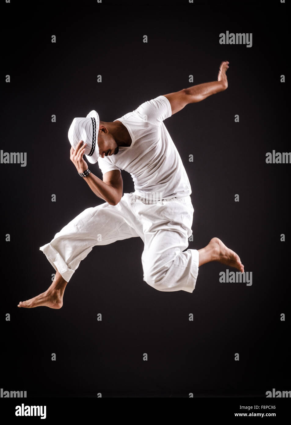 Dancer dancing dances in white clothing Stock Photo - Alamy