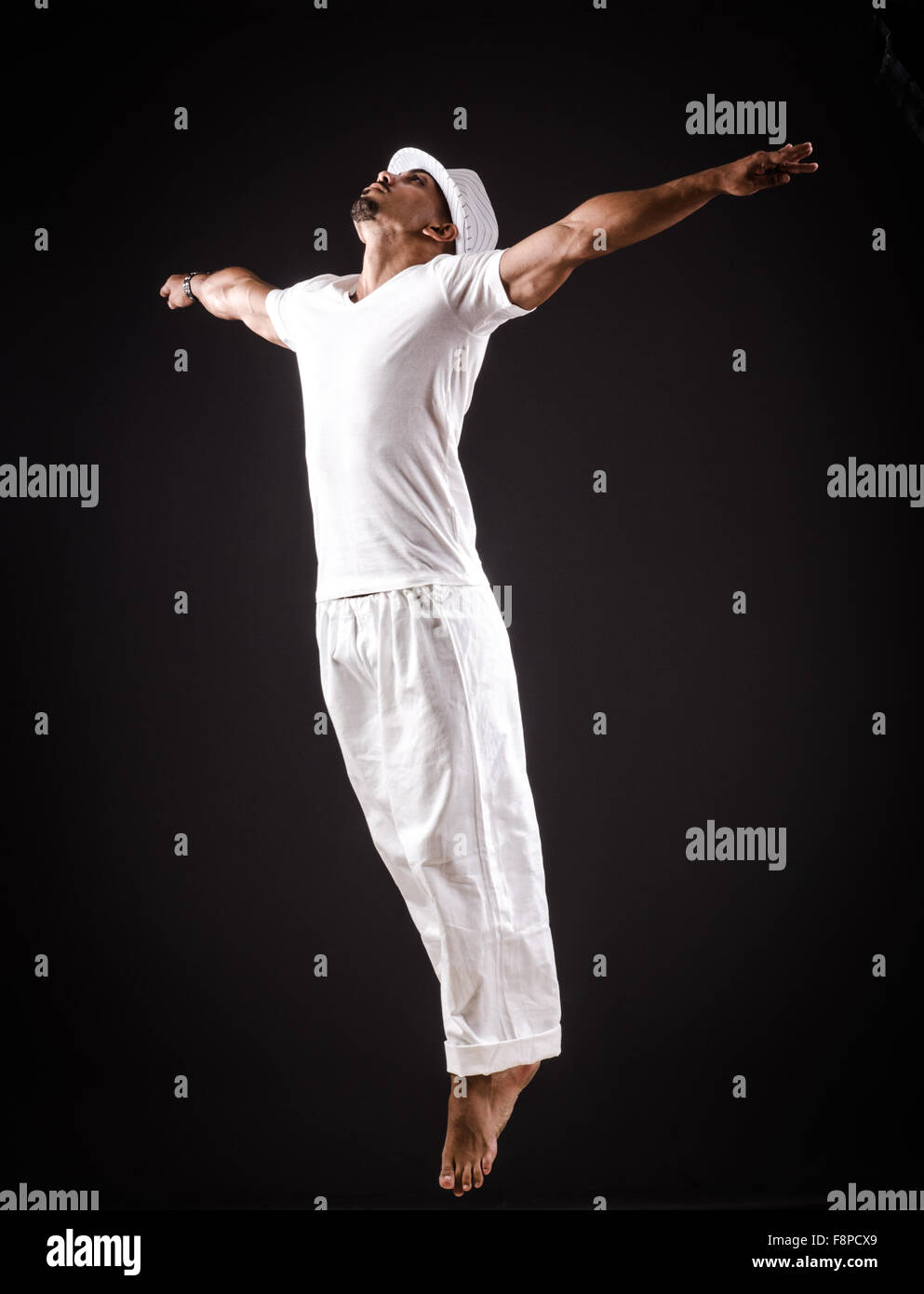 Dancer dancing dances in white clothing Stock Photo - Alamy