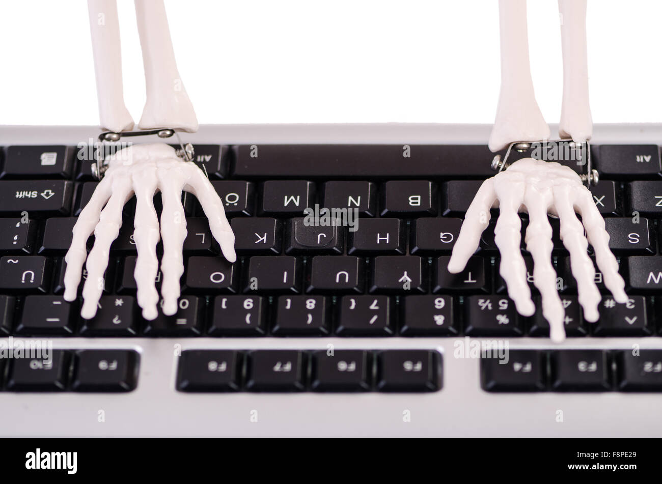 Skull on computer keyboard hi-res stock photography and images - Alamy