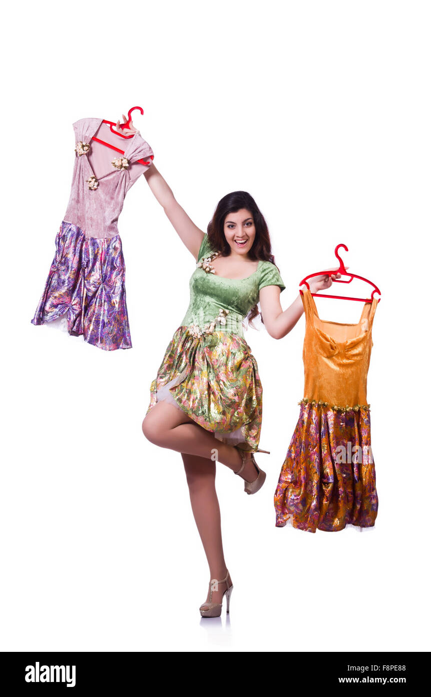 Woman trying to choose dress on white Stock Photo - Alamy