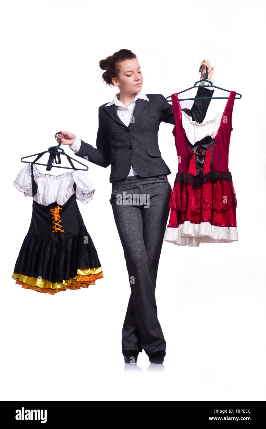 Woman trying to choose dress on white Stock Photo - Alamy