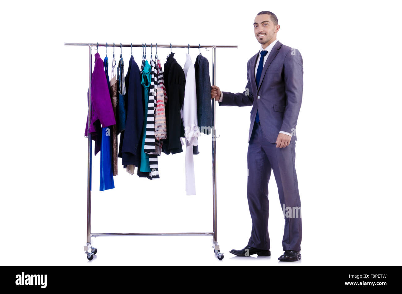 Businessman with rack of clothing Stock Photo - Alamy