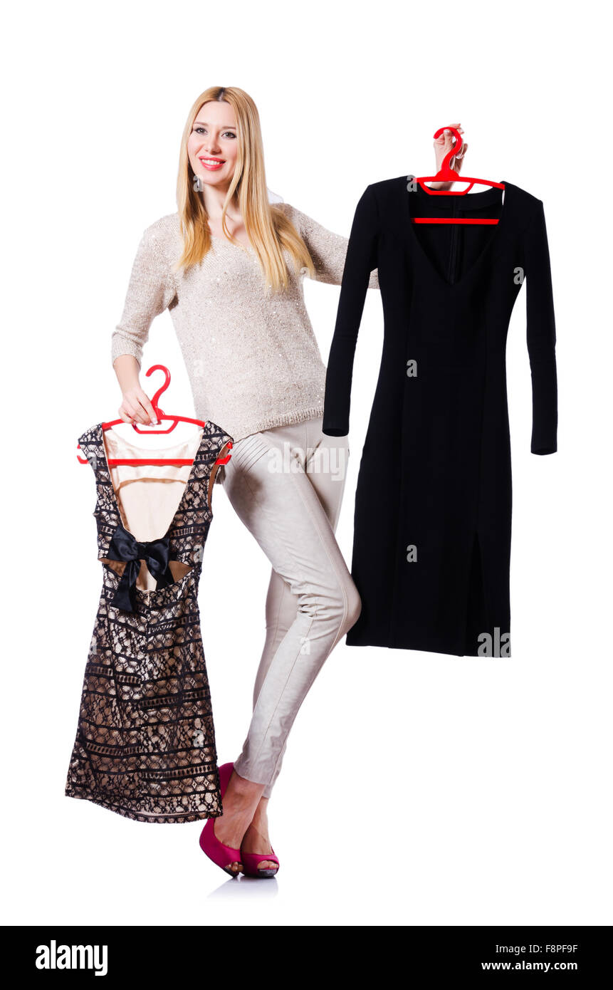 Woman trying to choose dress on white Stock Photo - Alamy
