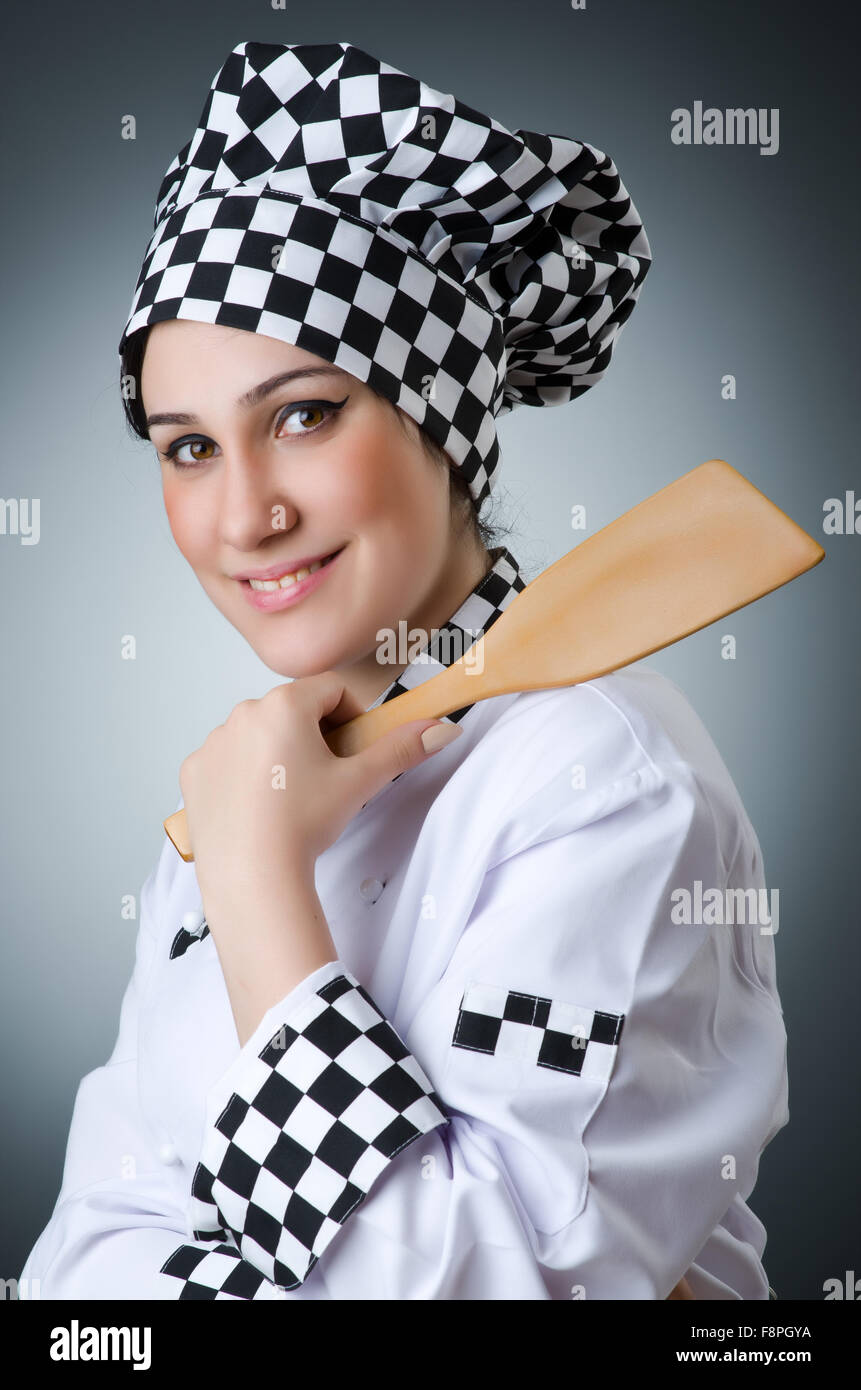Pretty cook with kitchen utensils Stock Photo - Alamy