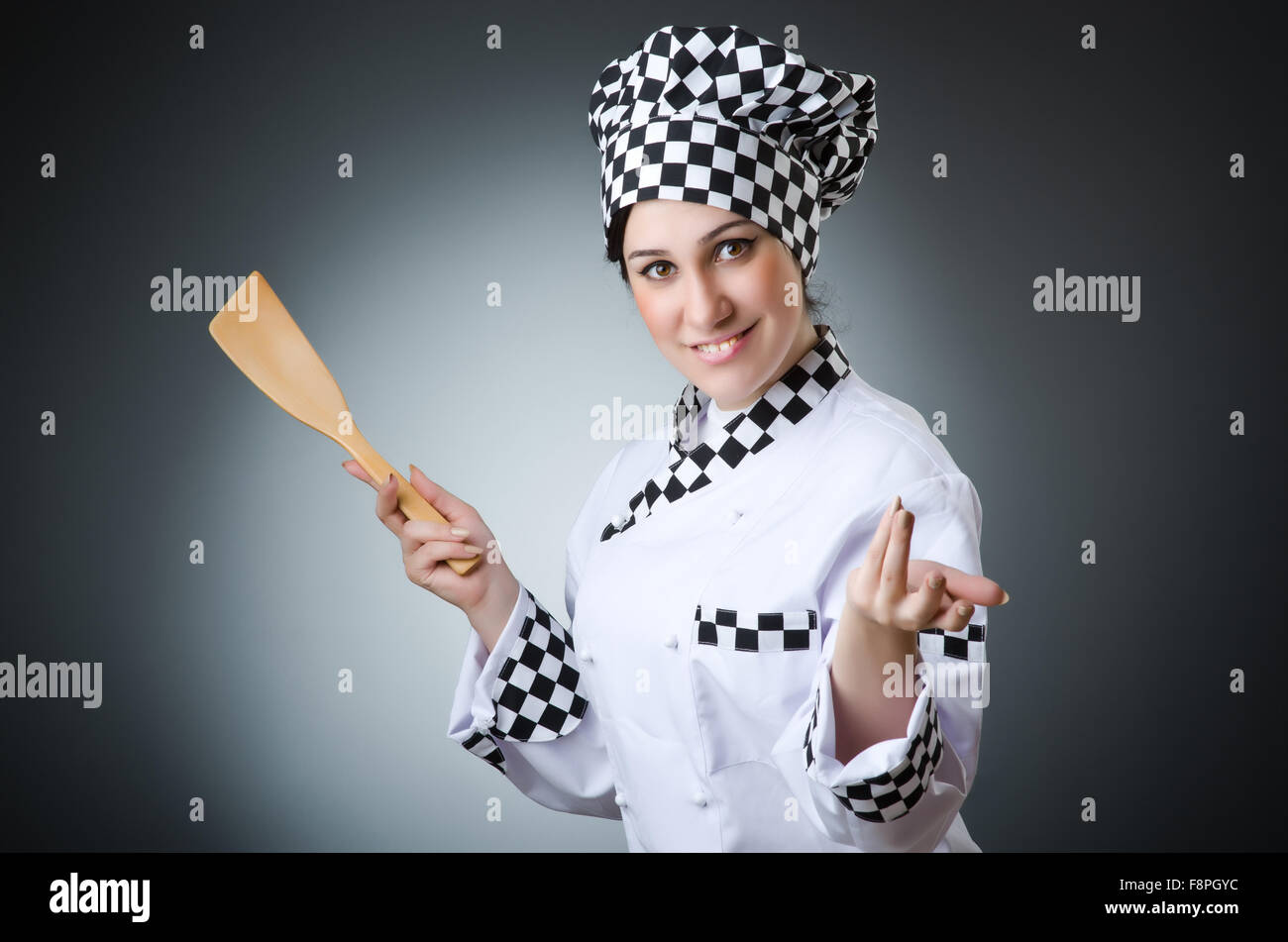 Pretty cook with kitchen utensils Stock Photo - Alamy