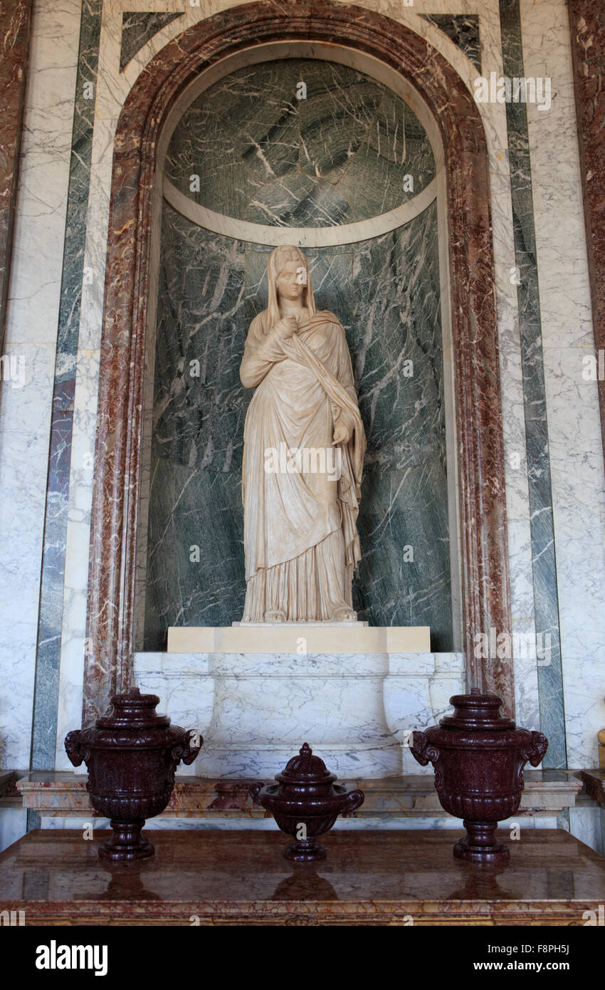 Various statues line the halls and rooms of the Palace of Versailles on ...