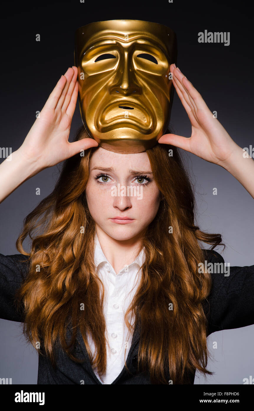 Woman with mask in hypocrisy concept Stock Photo - Alamy