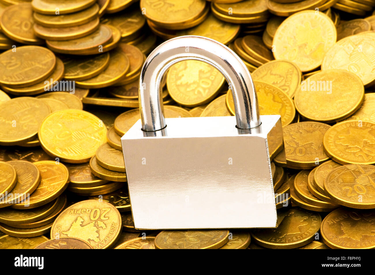 Concept of financial security with lock and coins Stock Photo - Alamy