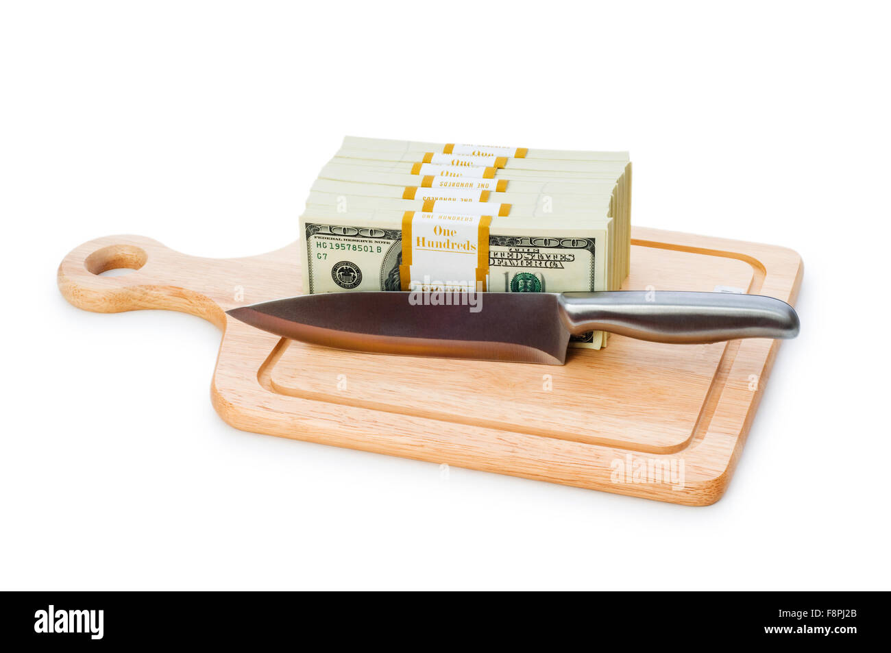 Money concept - cutting dollars with the knife Stock Photo - Alamy