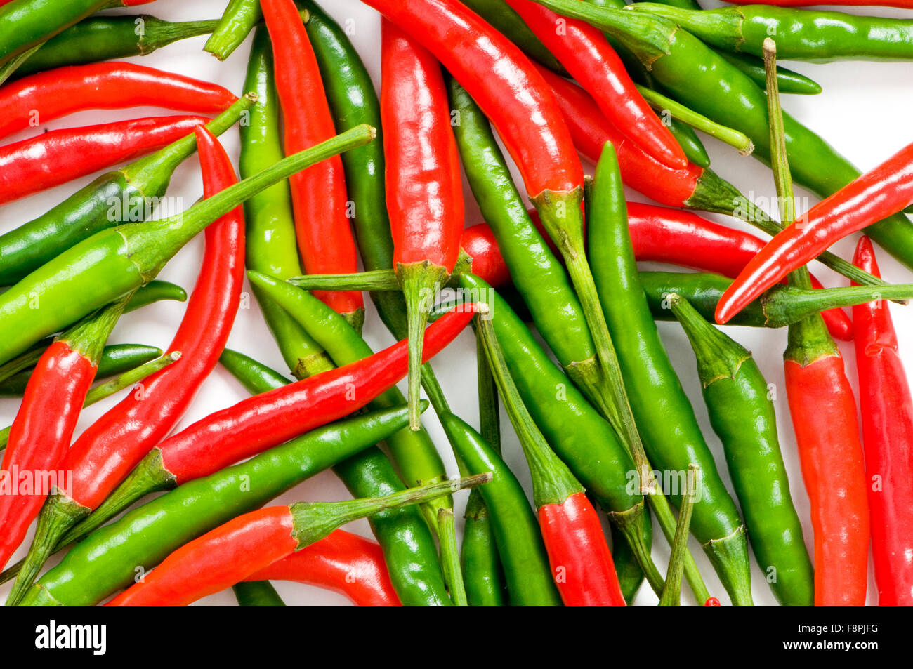 Red and green chili peppers at the background Stock Photo - Alamy