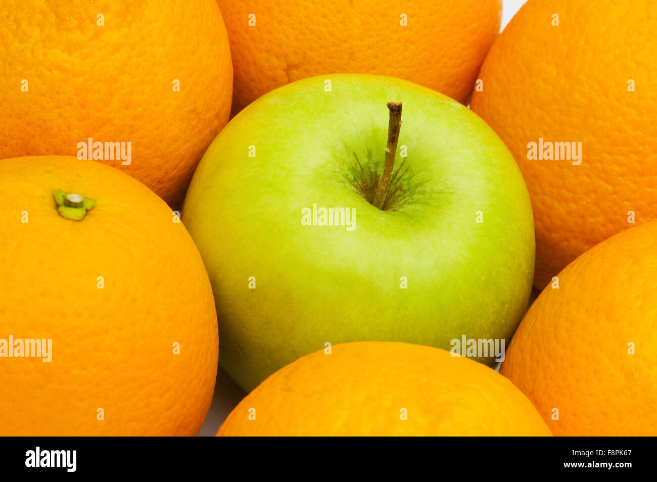 Stand out from crowd with apple and oranges Stock Photo - Alamy