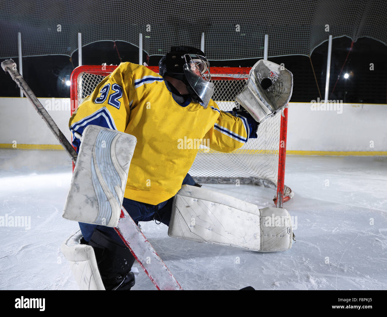 ice hockey goalkeeper player on goal in action Stock Photo - Alamy