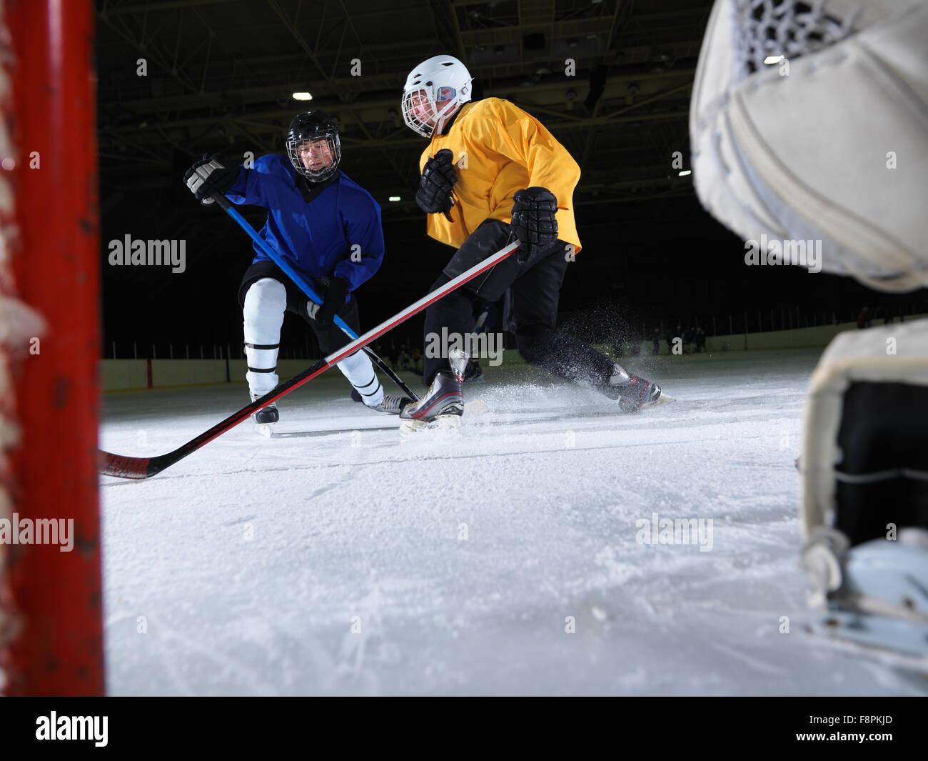 ice hockey goalkeeper player on goal in action Stock Photo - Alamy
