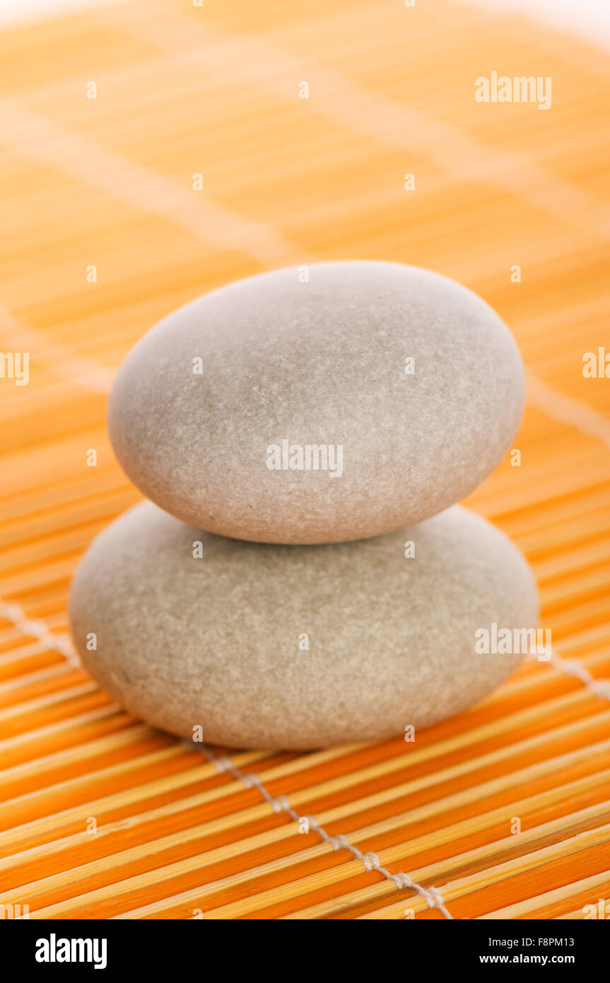 Stack of spa pebbles against blurred background Stock Photo - Alamy