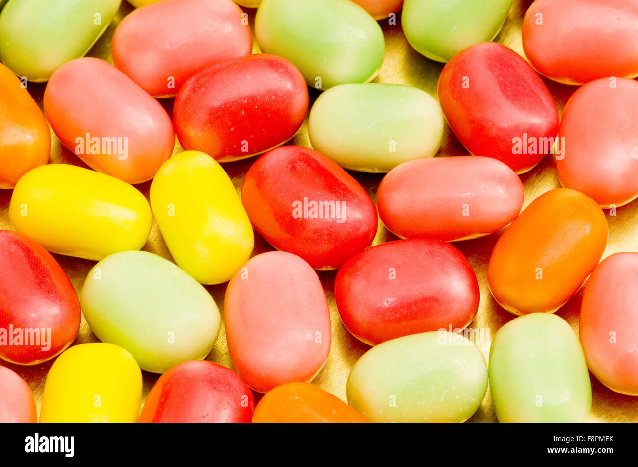 Various dry colourful sweets arranged as background Stock Photo - Alamy
