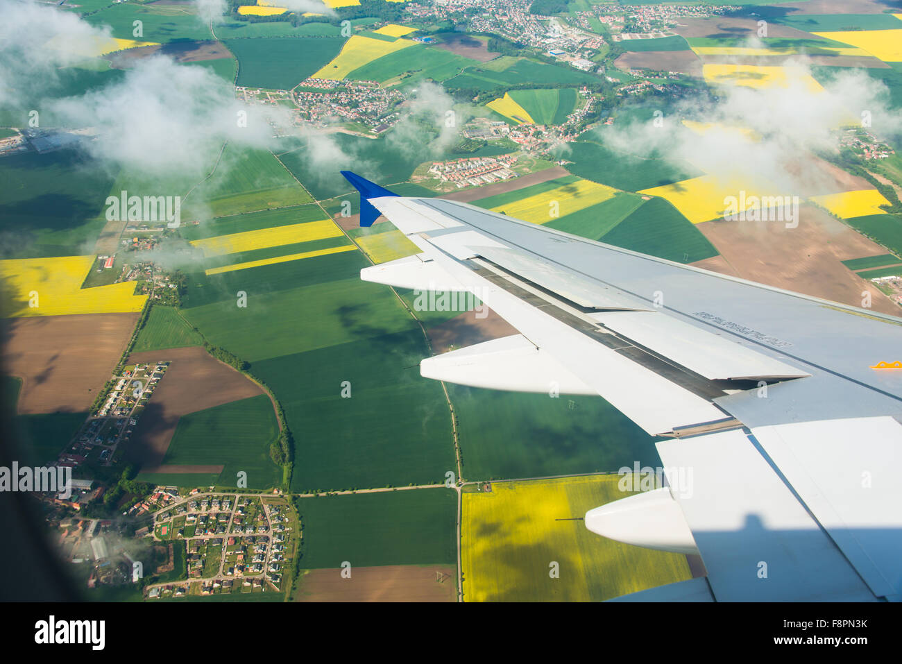 Airplane wing out of window Stock Photo - Alamy