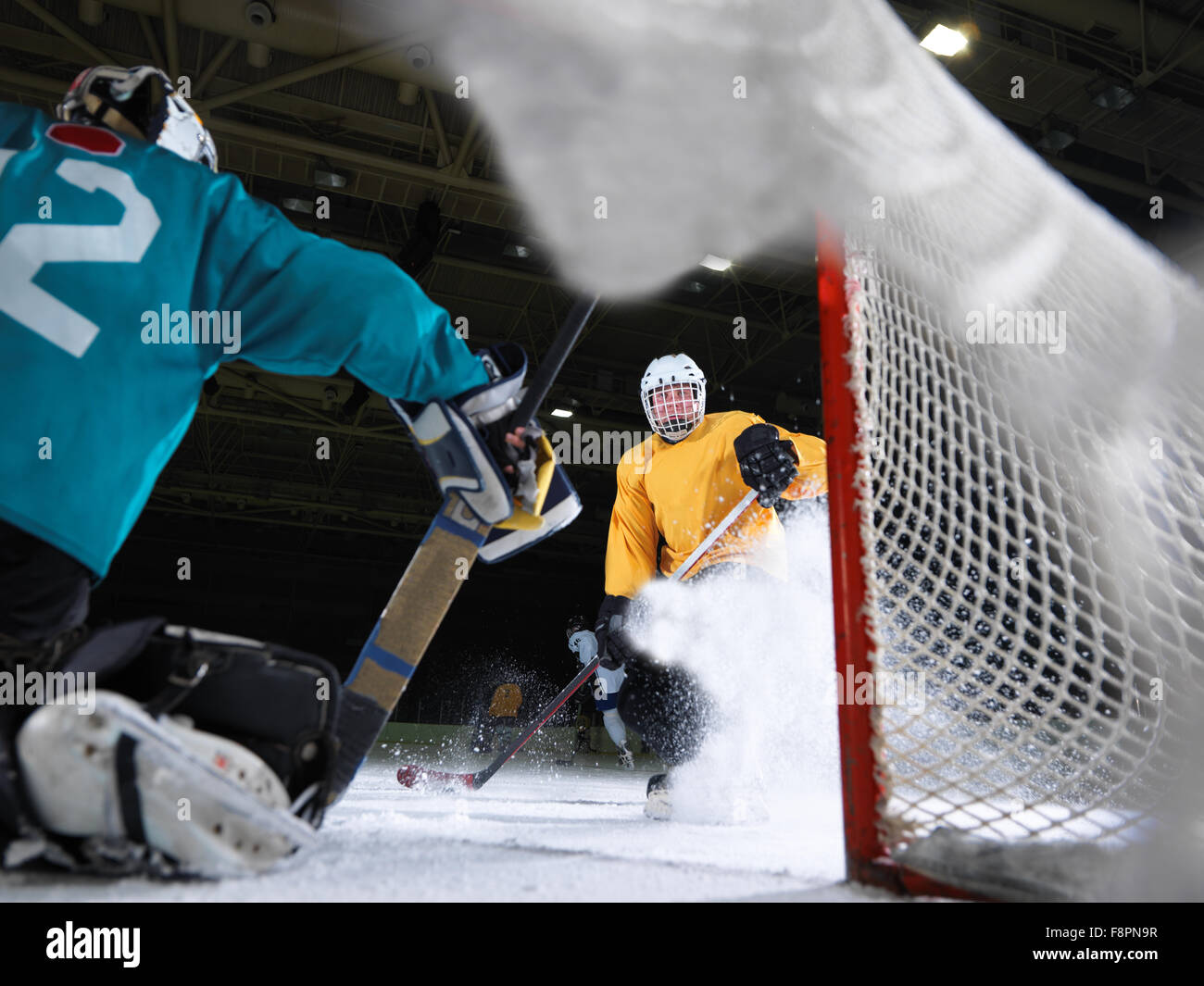 ice hockey goalkeeper player on goal in action Stock Photo - Alamy