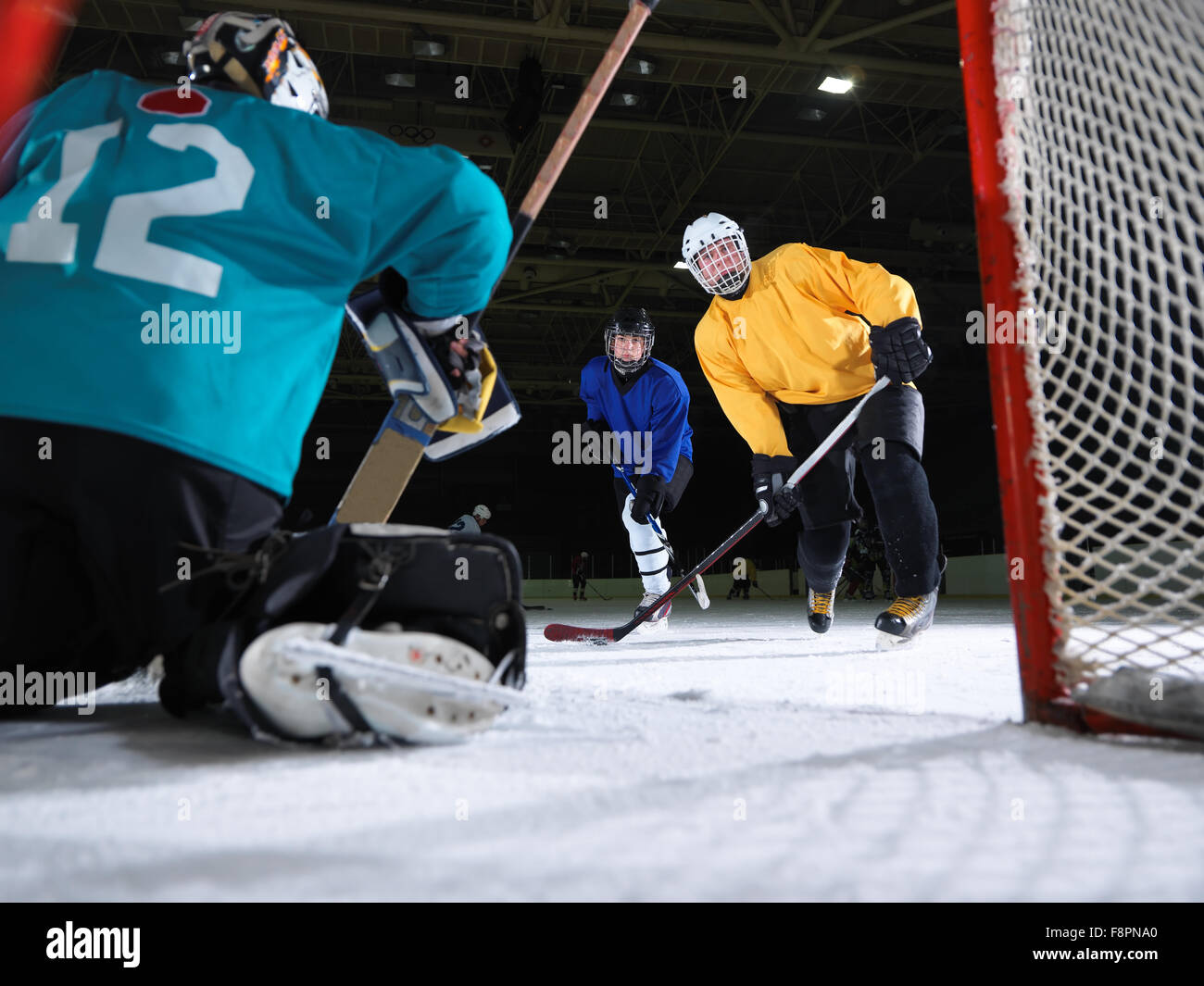 ice hockey goalkeeper player on goal in action Stock Photo - Alamy