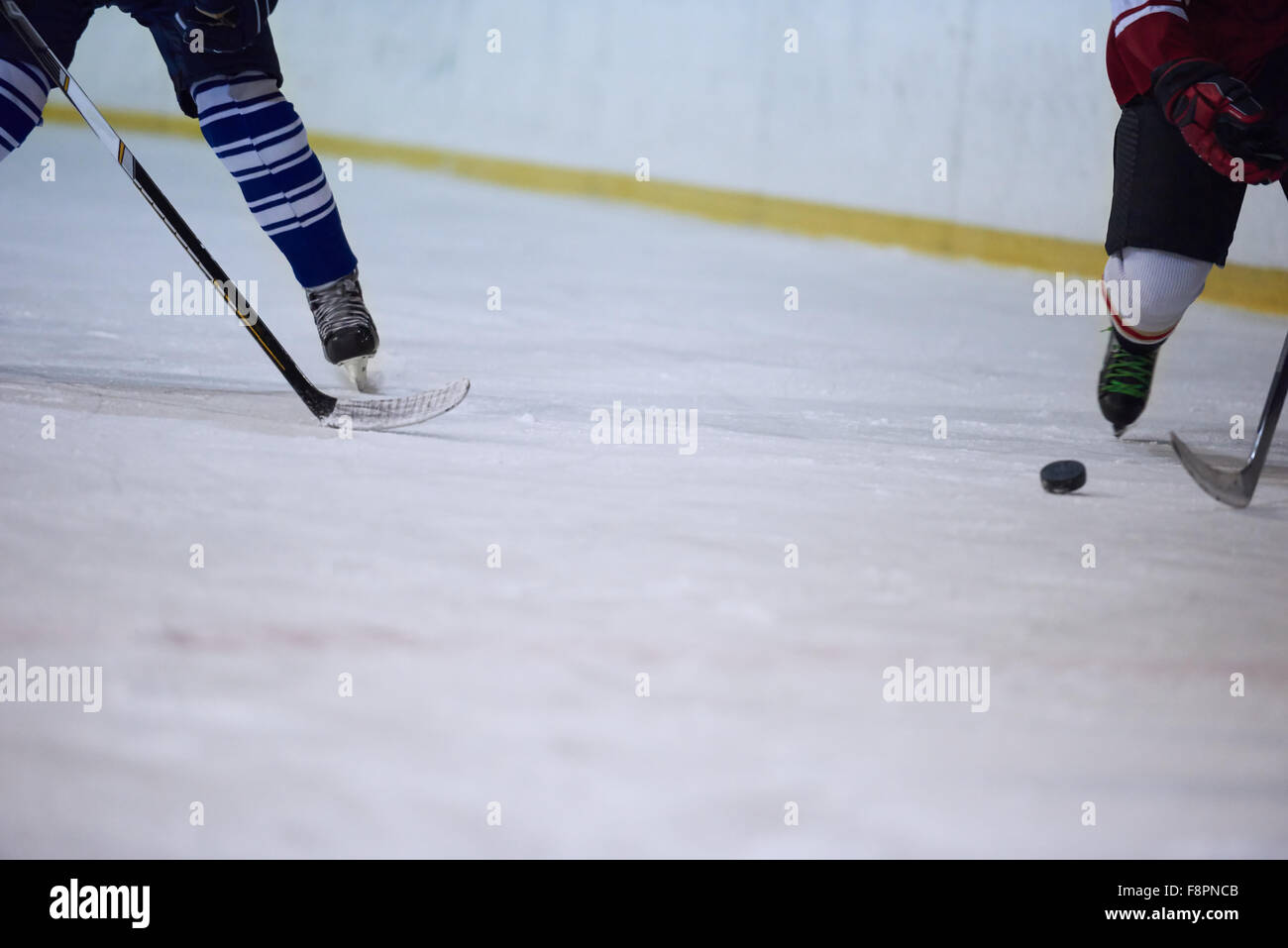 ice hockey player in action kicking with stick Stock Photo - Alamy