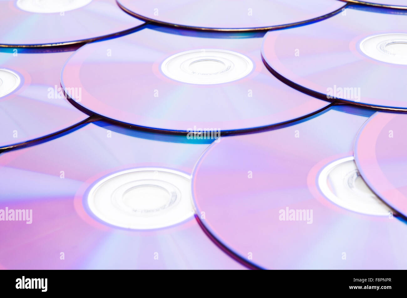Many DVD's arranged at the white background Stock Photo - Alamy