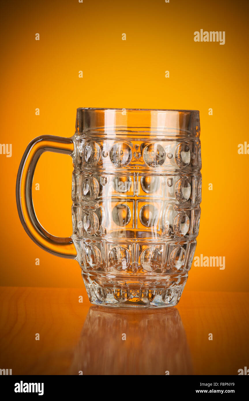 Beer glass against gradient background Stock Photo - Alamy