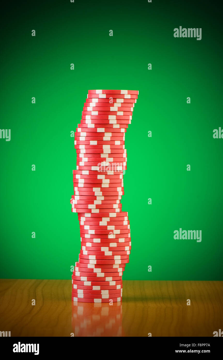 Stack of casino chips against gradient background Stock Photo - Alamy