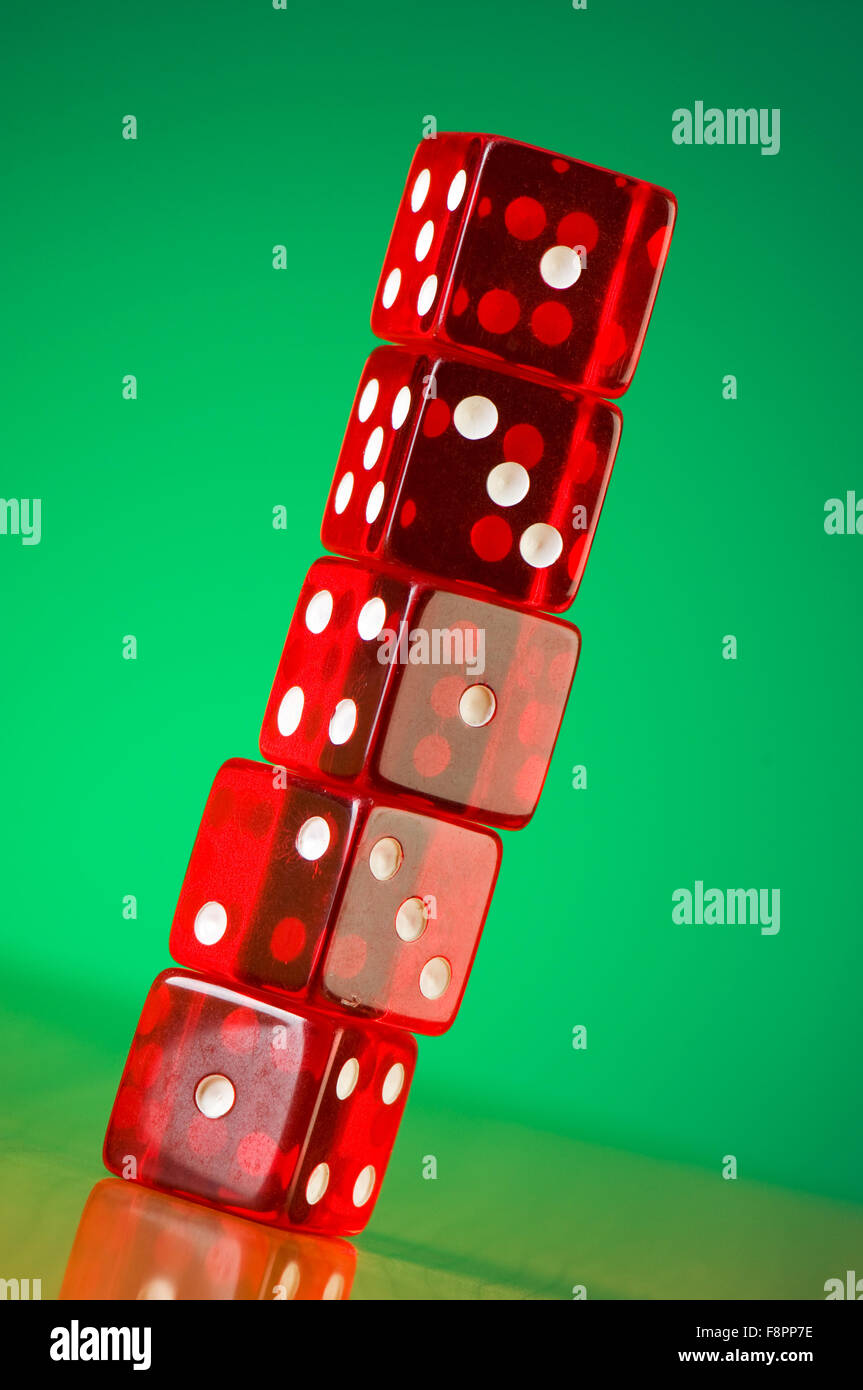 Stack of red casino dice against gradient background Stock Photo - Alamy