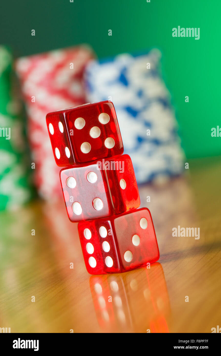 Stack of red casino dice against gradient background Stock Photo - Alamy