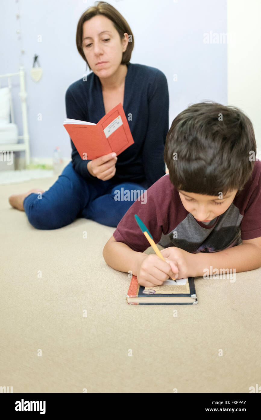 Mother helps her son with his spelling Stock Photo - Alamy Mother helps her son with his spelling Stock Photo - Alamy