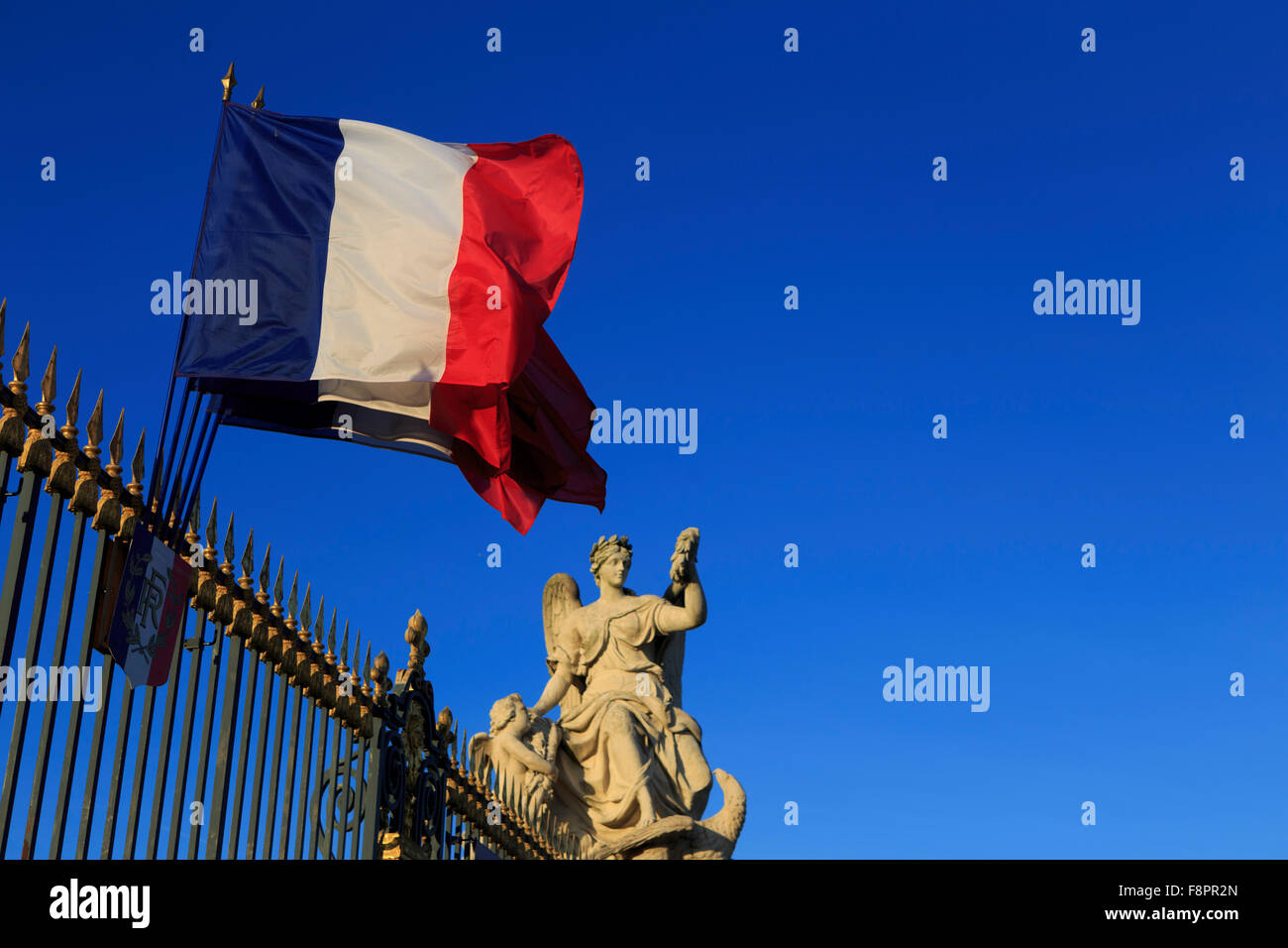 An angel statue at the Chateau Versaille on the outskirts of Paris ...