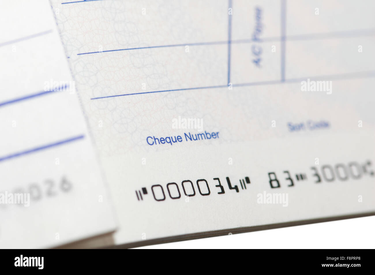 Close up of cheque book - shallow depth of field Stock Photo - Alamy