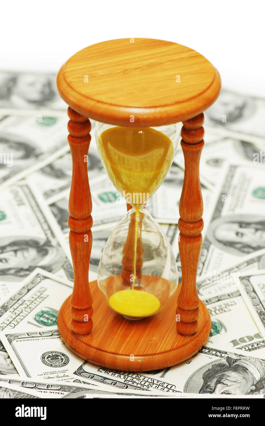 Time is money with dollar notes and hourglass Stock Photo - Alamy