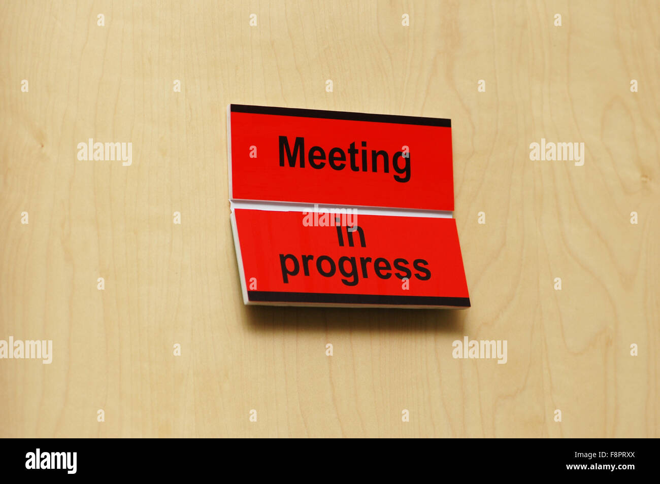 Meeting room with label "Meeting in progress Stock Photo - Alamy