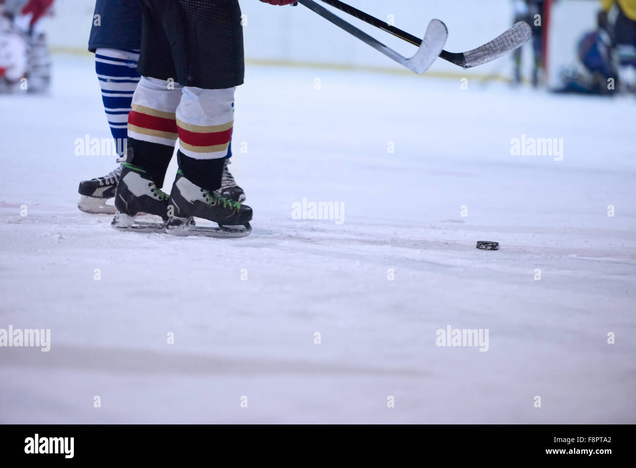 ice hockey player in action kicking with stick Stock Photo - Alamy