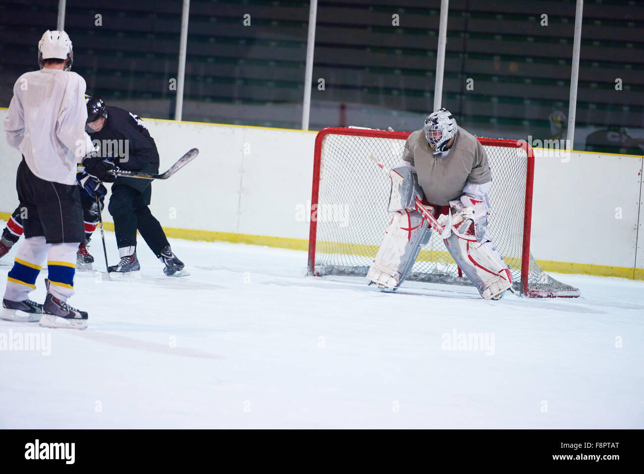 ice hockey player in action kicking with stick Stock Photo - Alamy