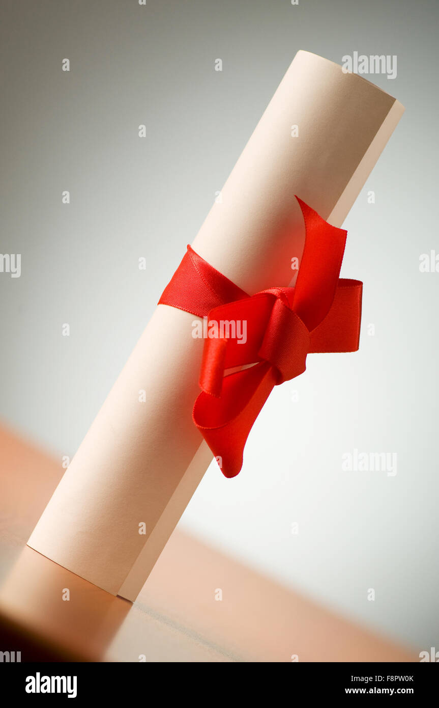 Education concept - diploma roll on the wooden table Stock Photo - Alamy