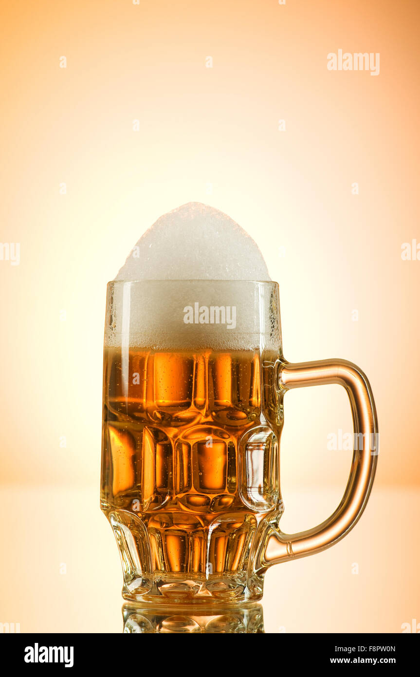 Beer glasses against the colorful gradient background Stock Photo - Alamy