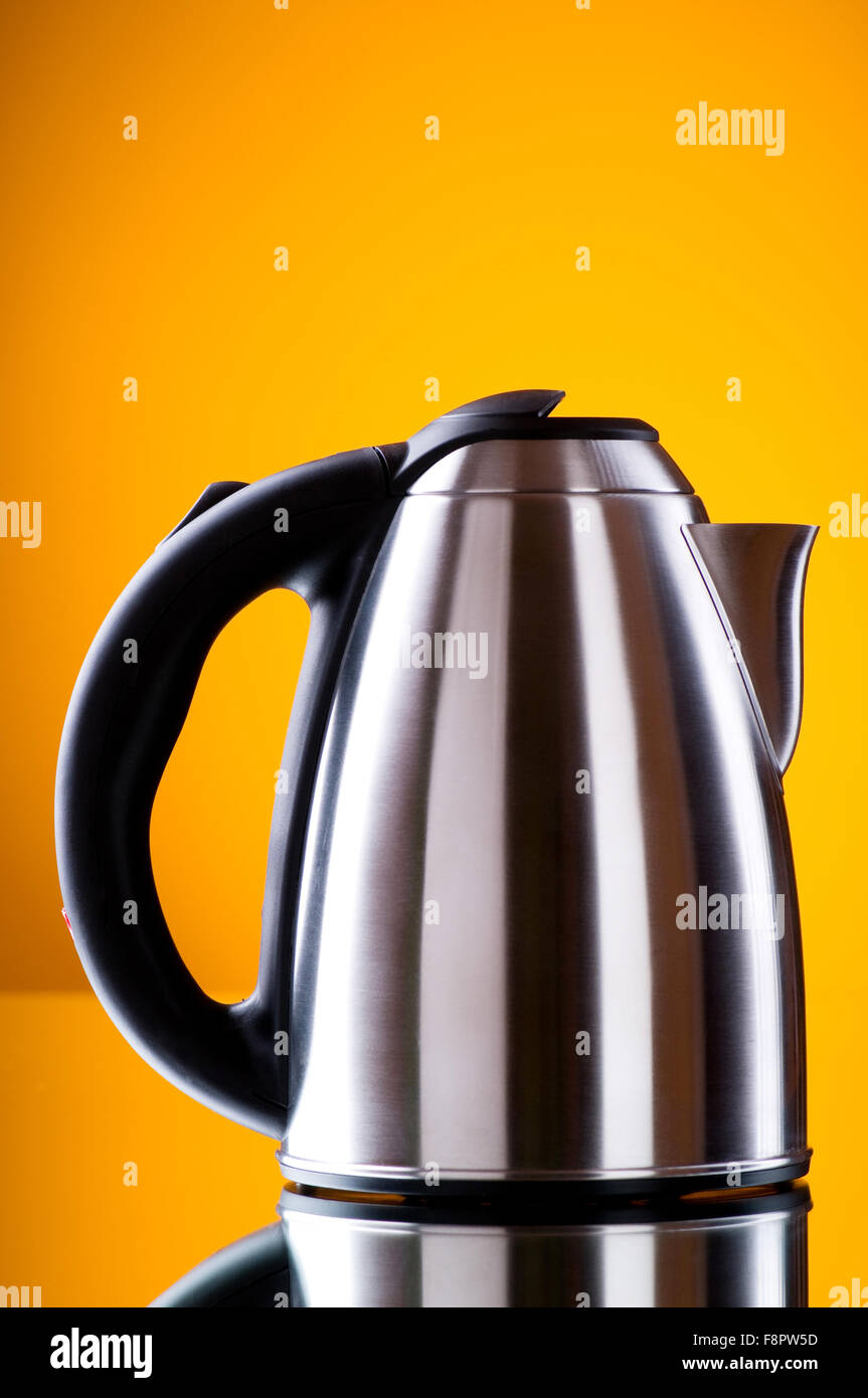 Shiny kettle against the colorful gradient background Stock Photo - Alamy