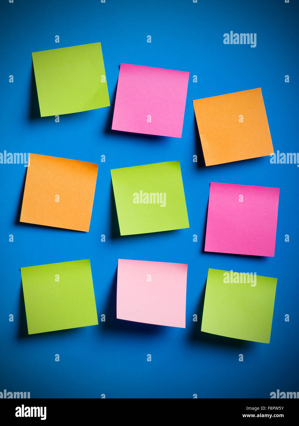 Reminder notes on the bright colorful paper Stock Photo - Alamy