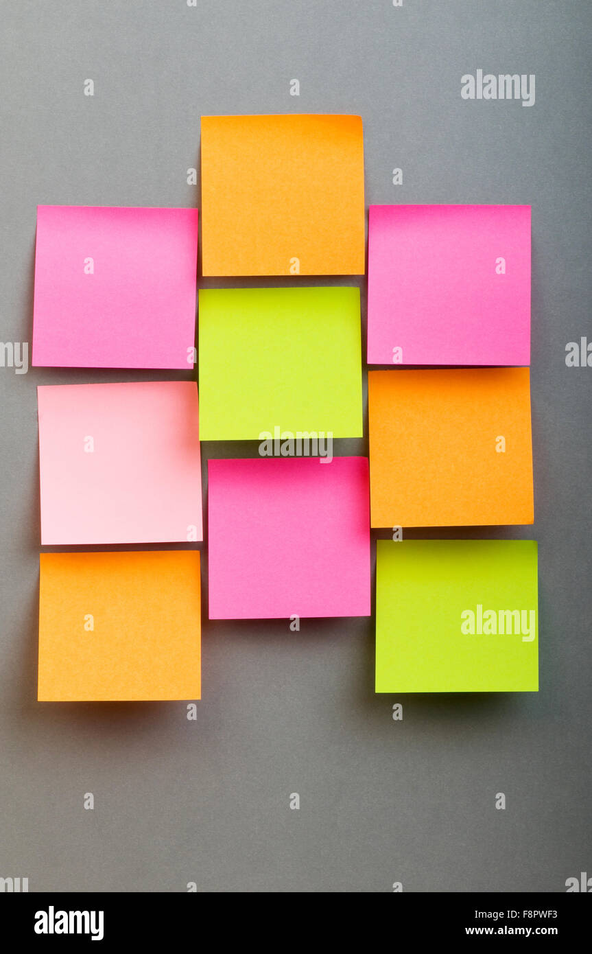 Reminder notes on the bright colorful paper Stock Photo - Alamy