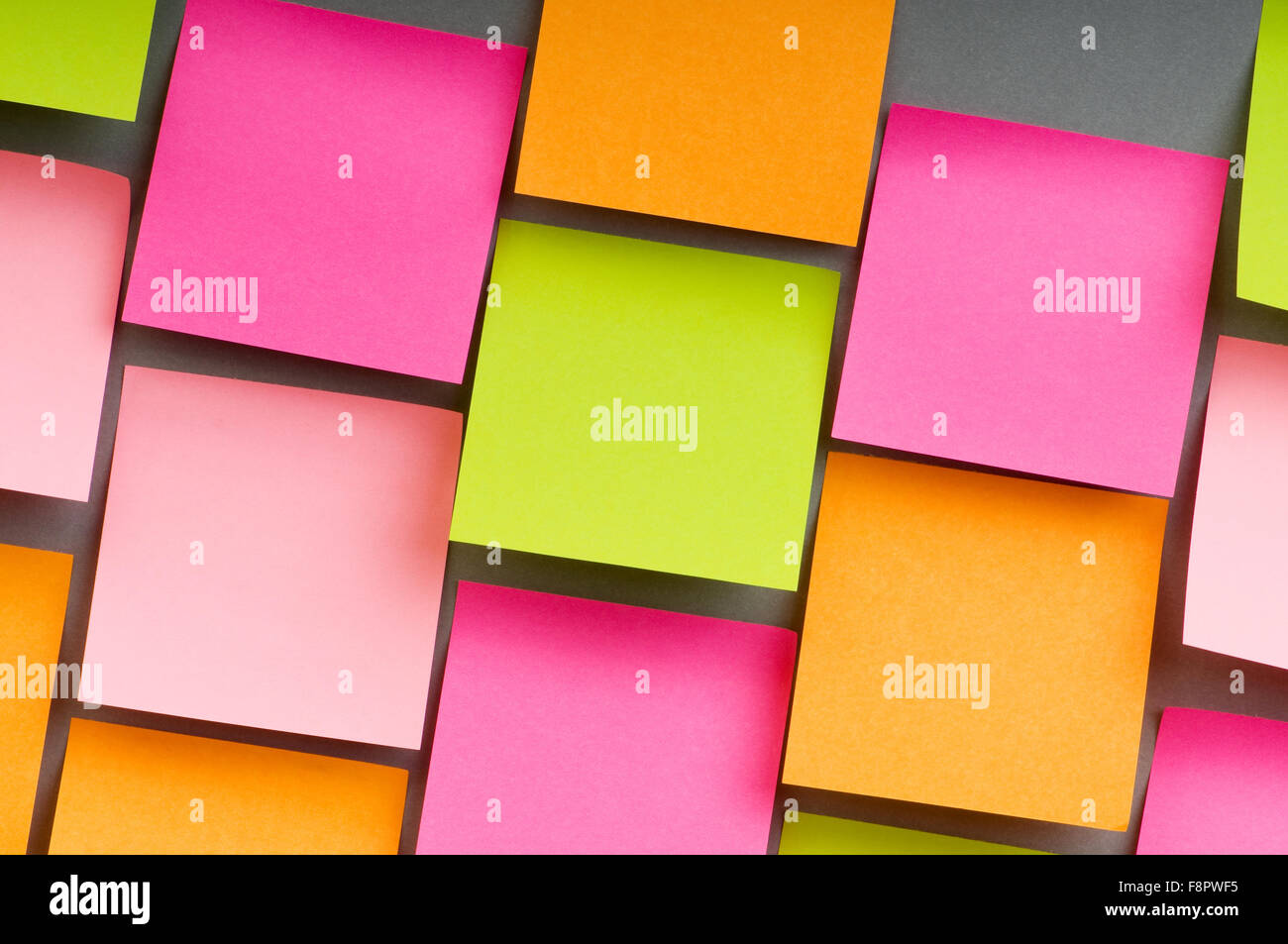Reminder notes on the bright colorful paper Stock Photo - Alamy