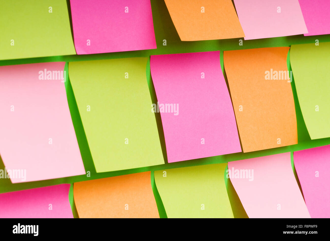 Reminder notes on the bright colorful paper Stock Photo - Alamy