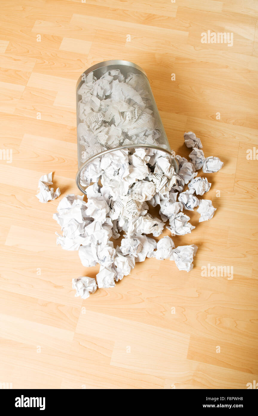 Garbage bin with paper waste isolated on white Stock Photo - Alamy