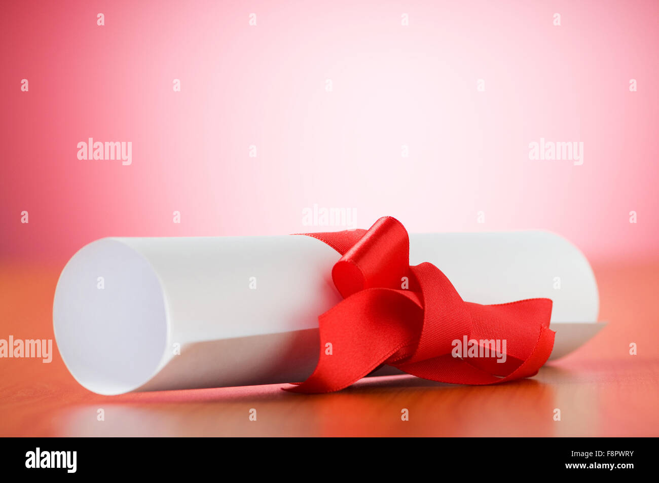 Education concept - diploma roll on the wooden table Stock Photo - Alamy